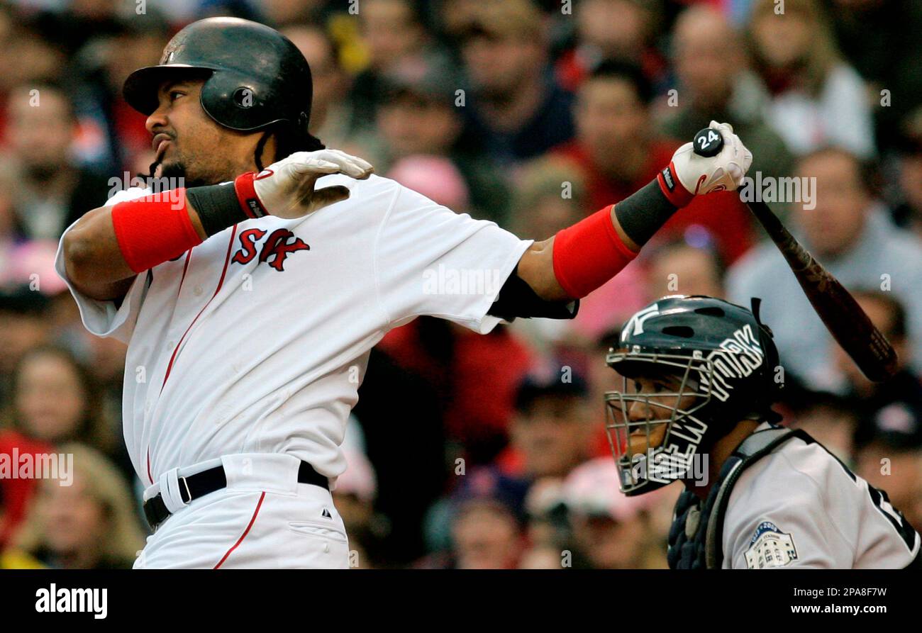 Boston Red Sox batter Manny Ramirez, left, and New York Yankees catcher ...