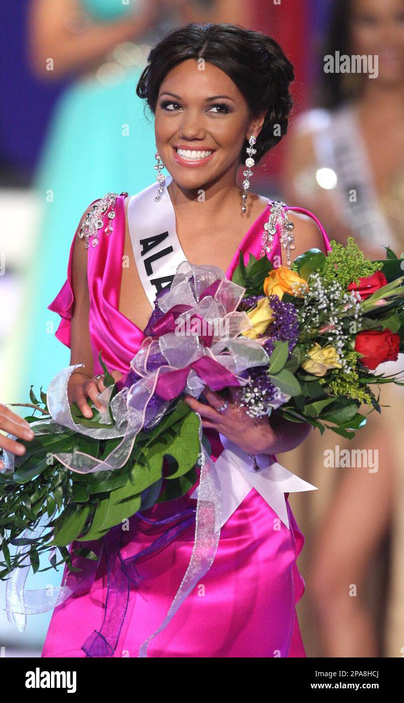 Miss Alaska, Courtney Erin Carroll, reacts as she is awarded the new ...