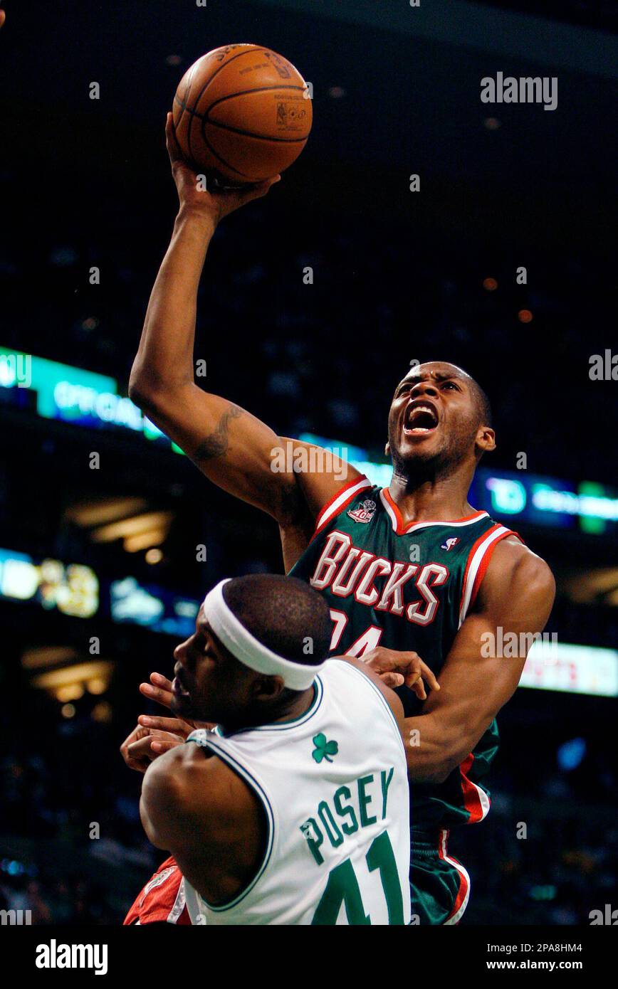 Milwaukee Bucks' Desmond Mason, top, tries to shoot and is fouled by ...