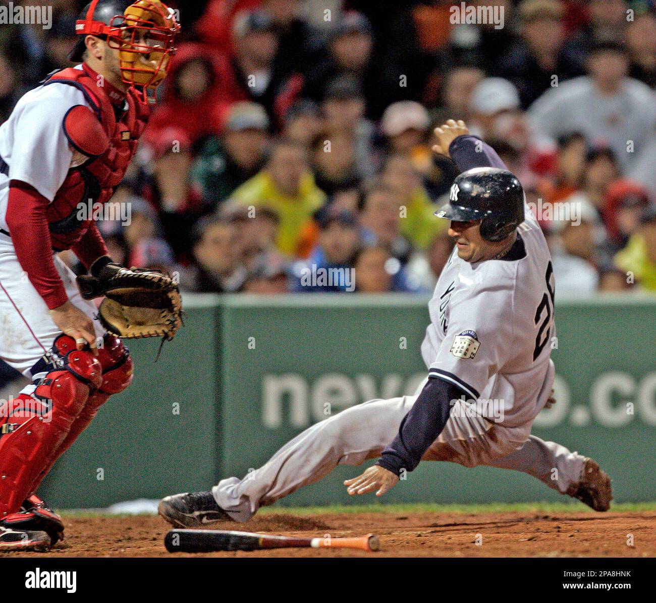 Boston Red Sox catcher Jason Varitek, left, waits for the late throw as ...