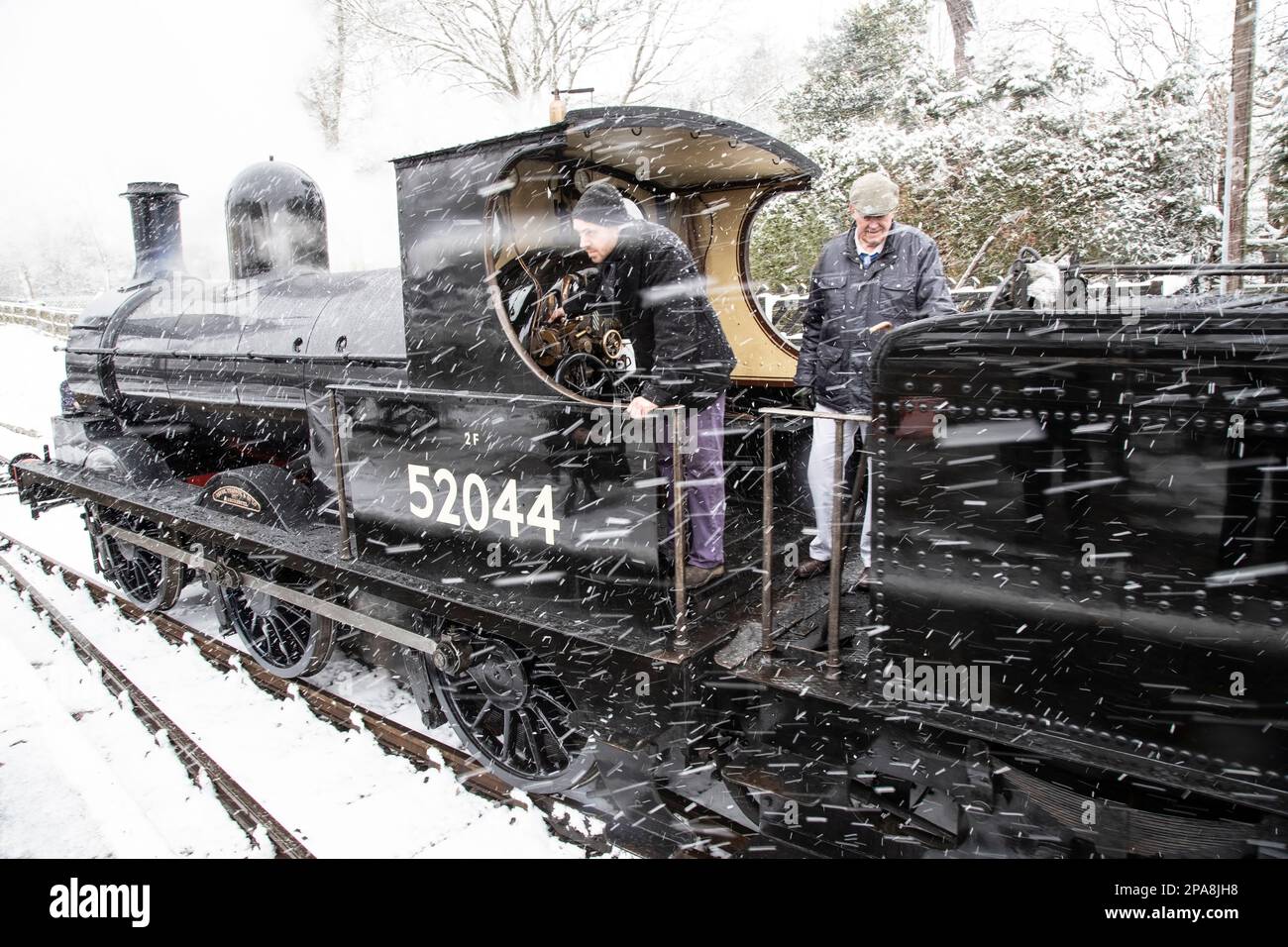 Steam train in heavy snow hi-res stock photography and images - Alamy