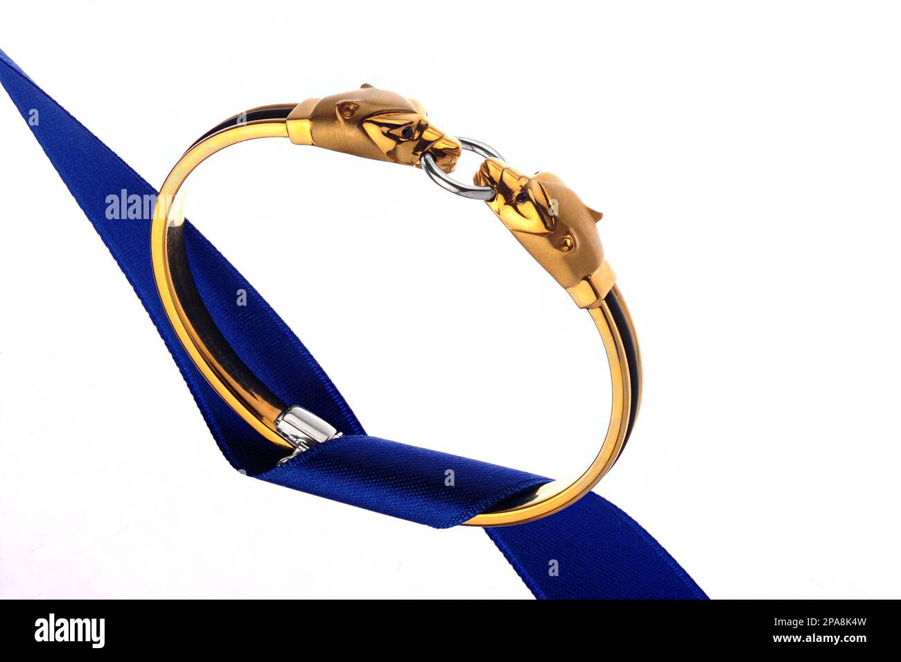 gold bracelet for men wrapped in blue ribbon Stock Photo - Alamy