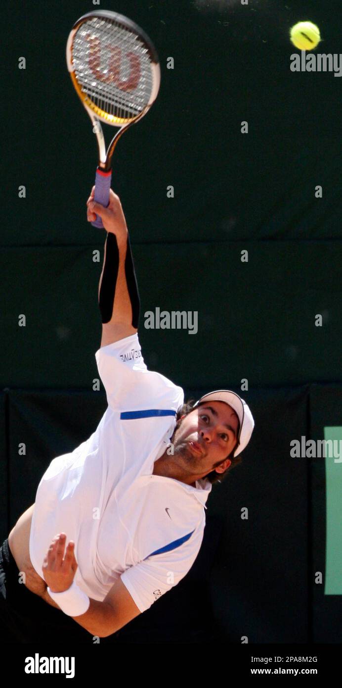 Iran's tennis player Benjamin Ebrahimzadeh, serves to Malaysian Selvem ...