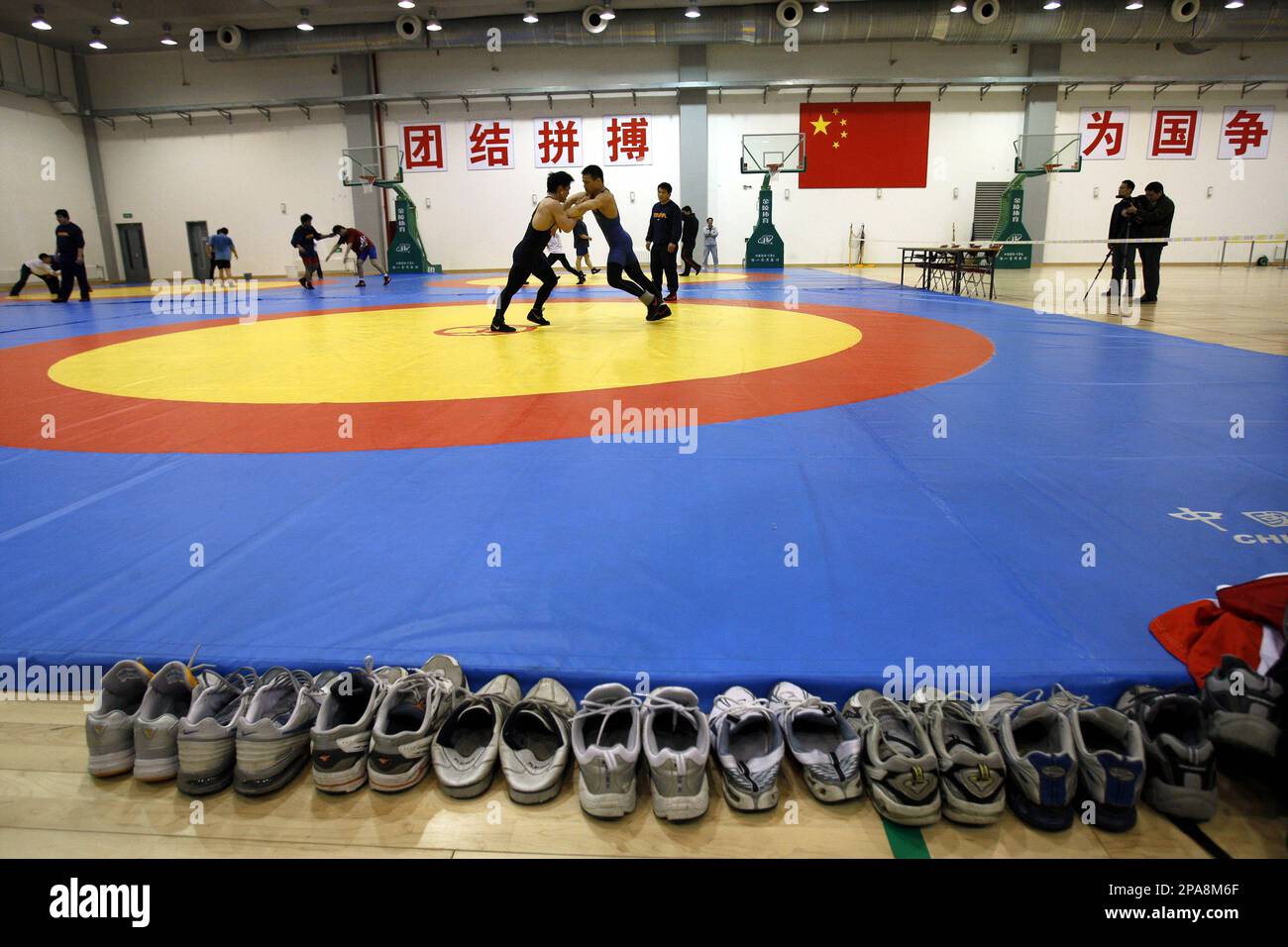 Wrestlers train at the Olympic Sports Center in Beijing Friday April 11 ...
