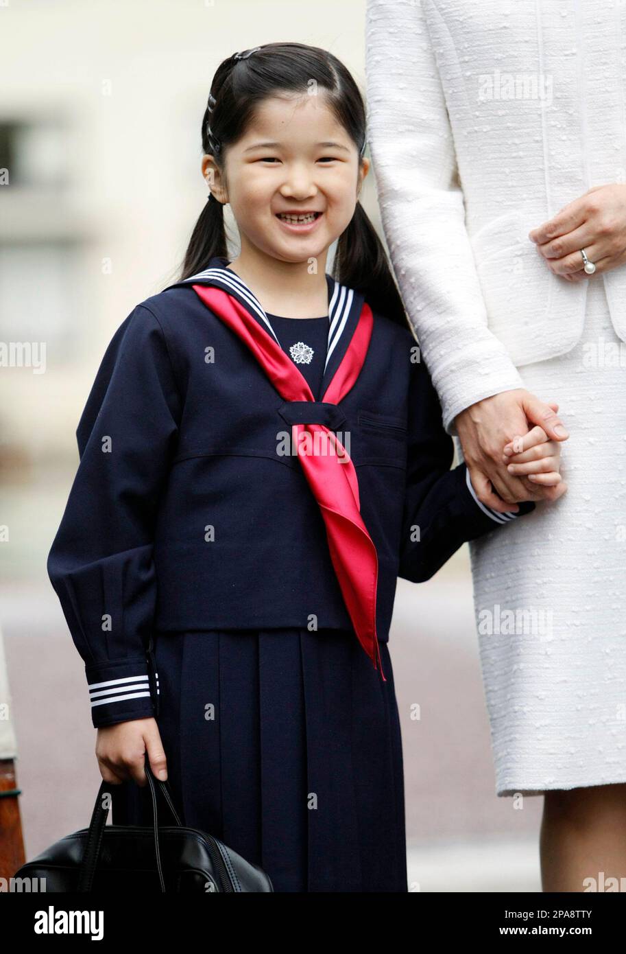 Japan's Princess Aiko, accompanied by her mother Crown Princess Masako ...