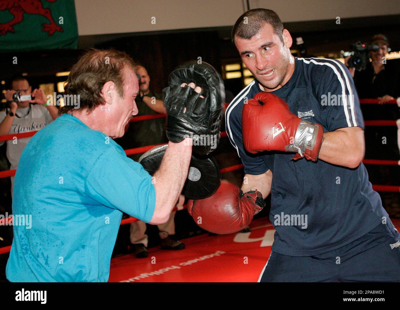Boxer Joe Calzaghe, right, of Wales, trains with his father and trainer ...