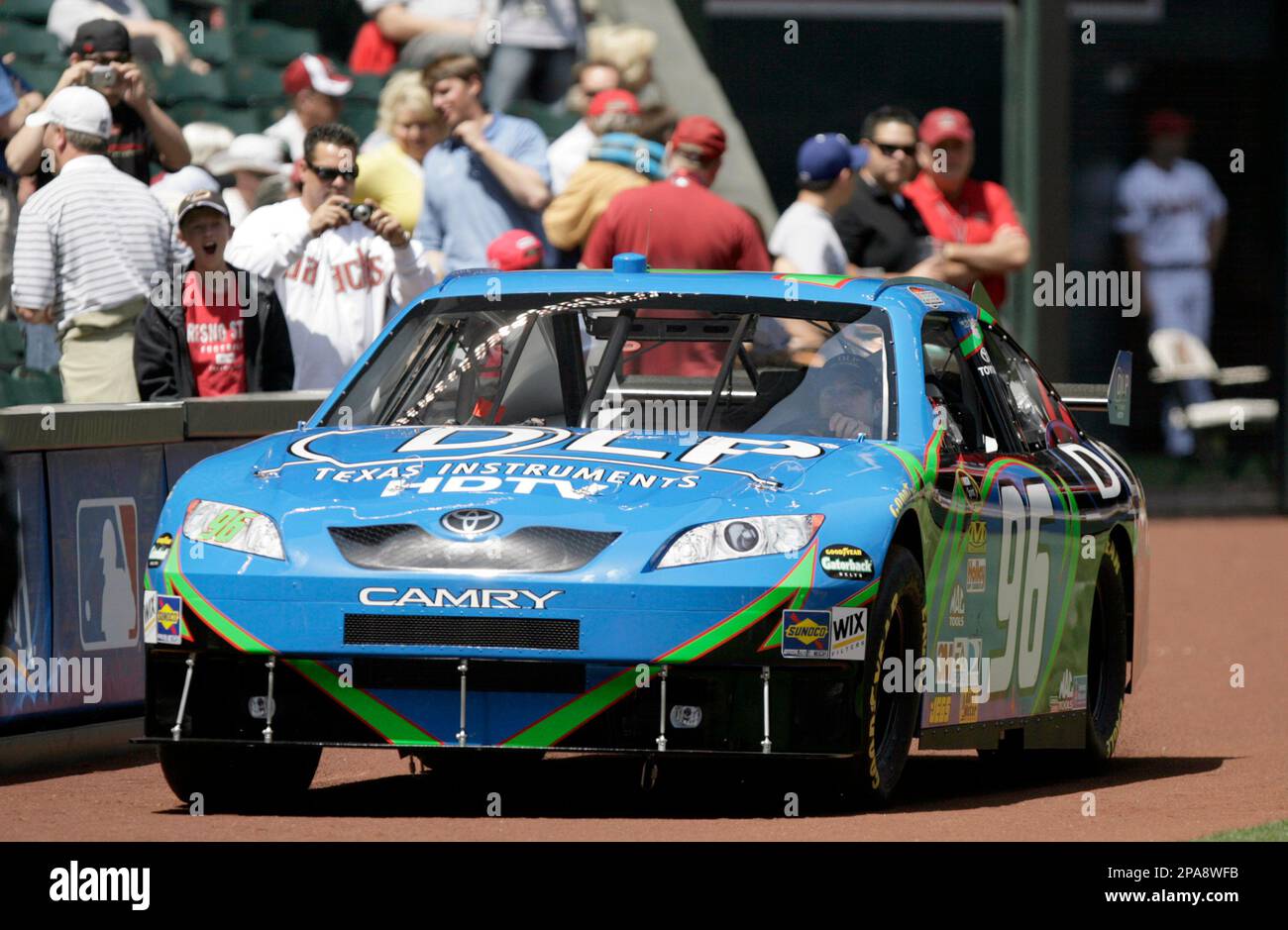 NASCAR driver J.J. Yeley drives his race car along the left-field line ...