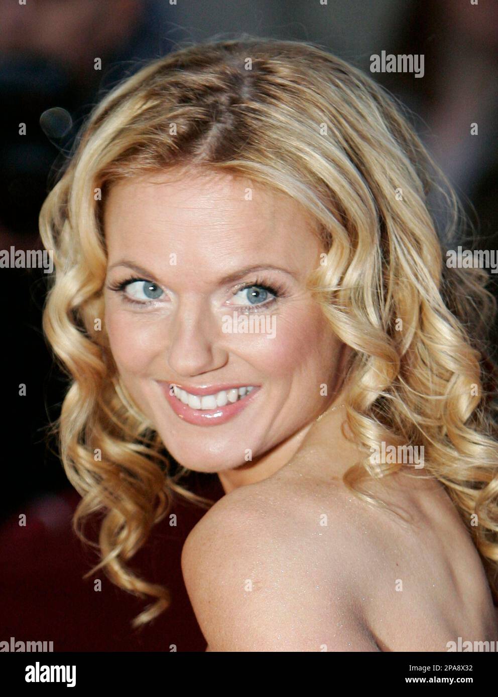 Geri Halliwell of the Spice Girls poses for the photographers as she ...