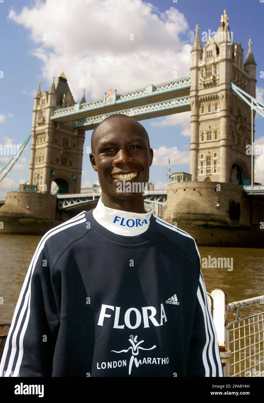 Kenyan marathon runner Luke Kibet poses for photographers in front of ...