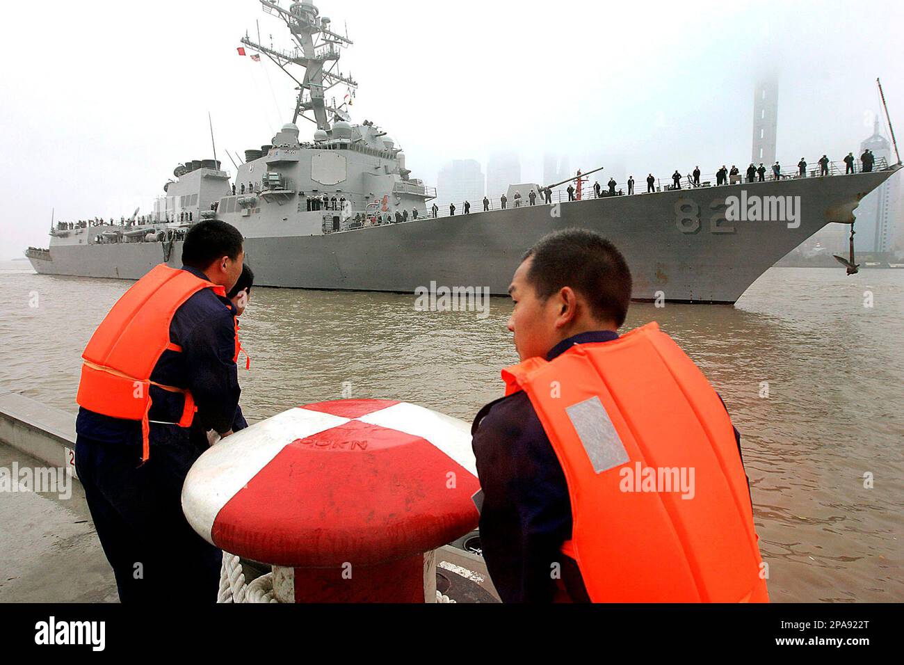 Chinese Navy personnel get ready to guided missile destroyer USS Lassen ...