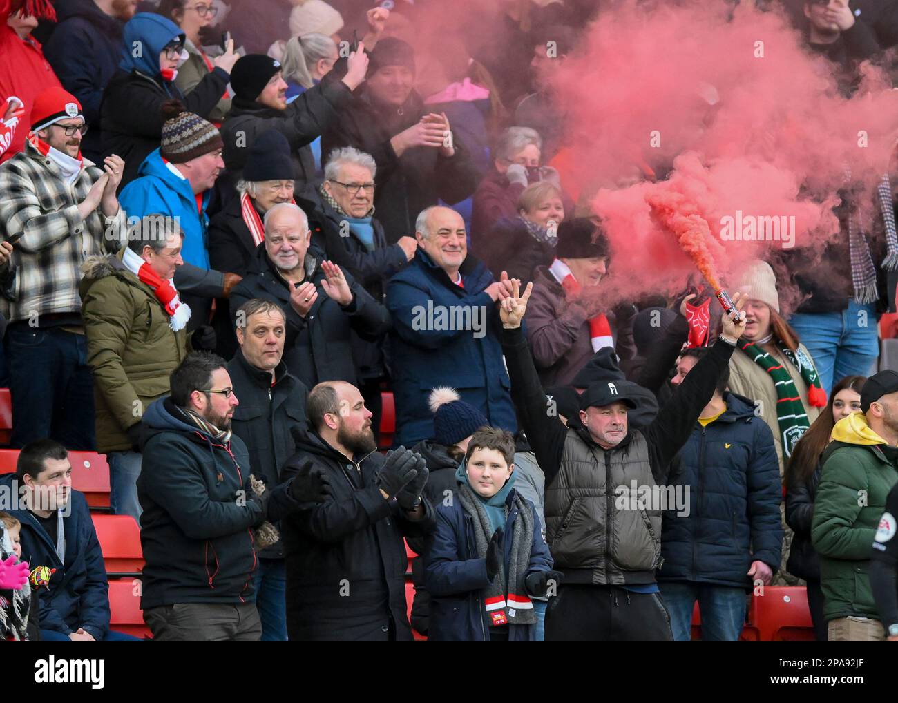 Barnsley fans with flare during the Sky Bet League 1 match Barnsley vs ...