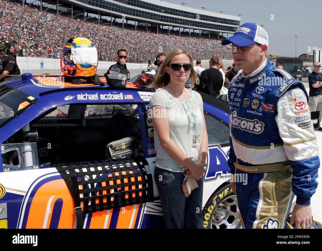 NASCAR driver Michael McDowell and his wife Jamie stand by his car ...