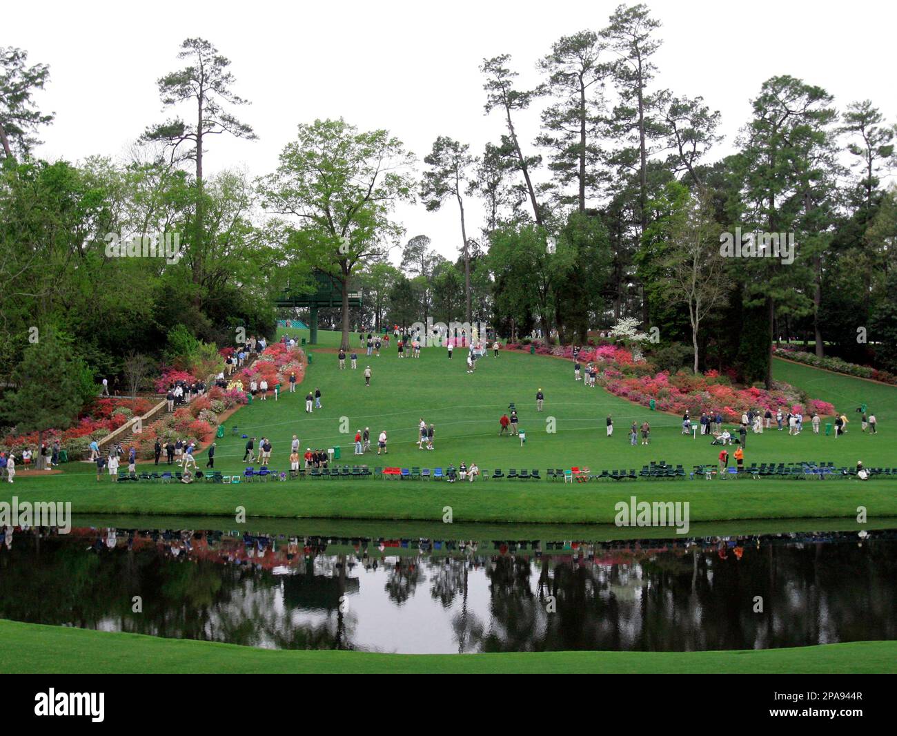 Patrons walk around near the 16th hole during practice for the 2008 ...
