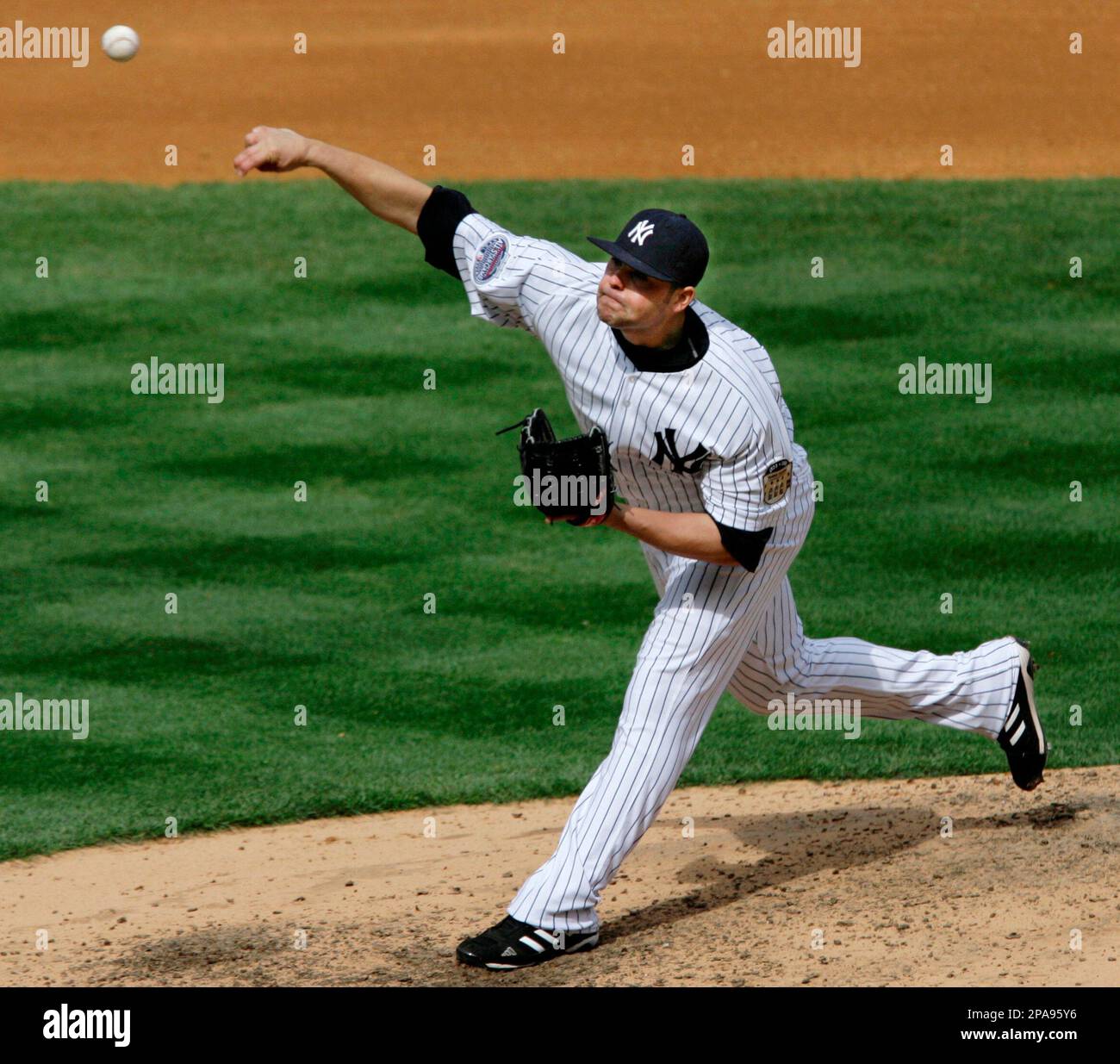 New York Yankees Joba Chamberlain delivers in the seventh inning of the ...