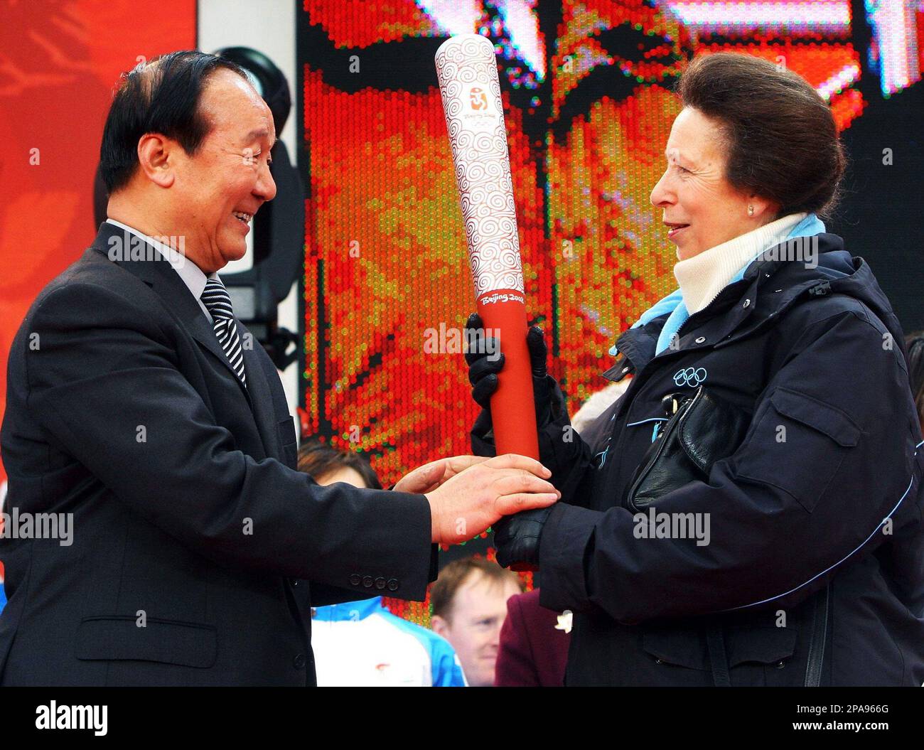 Britain's Princess Anne accepts the Olympic torch from Executive Vice ...