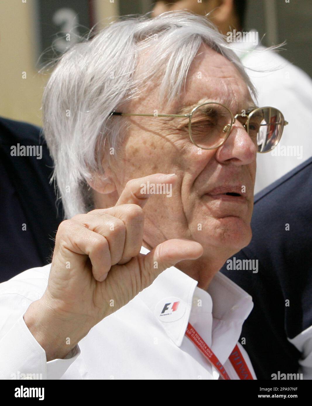 Bernie Ecclestone, President and CEO of the Formula One management gestures at the paddock prior ...