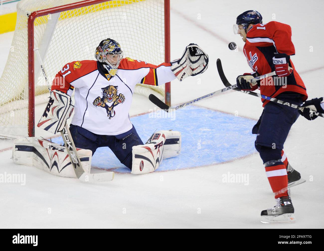 Washington Capitals' Eric Fehr (14) looks for the puck against Florida ...
