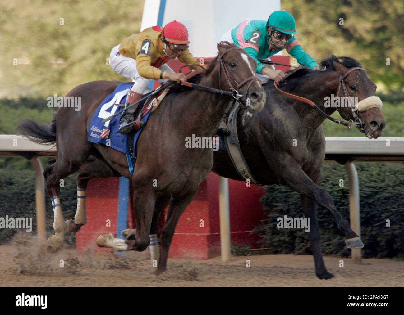 Tiago, right, and jockey Mike Smith, right, race past Heatseeker and ...