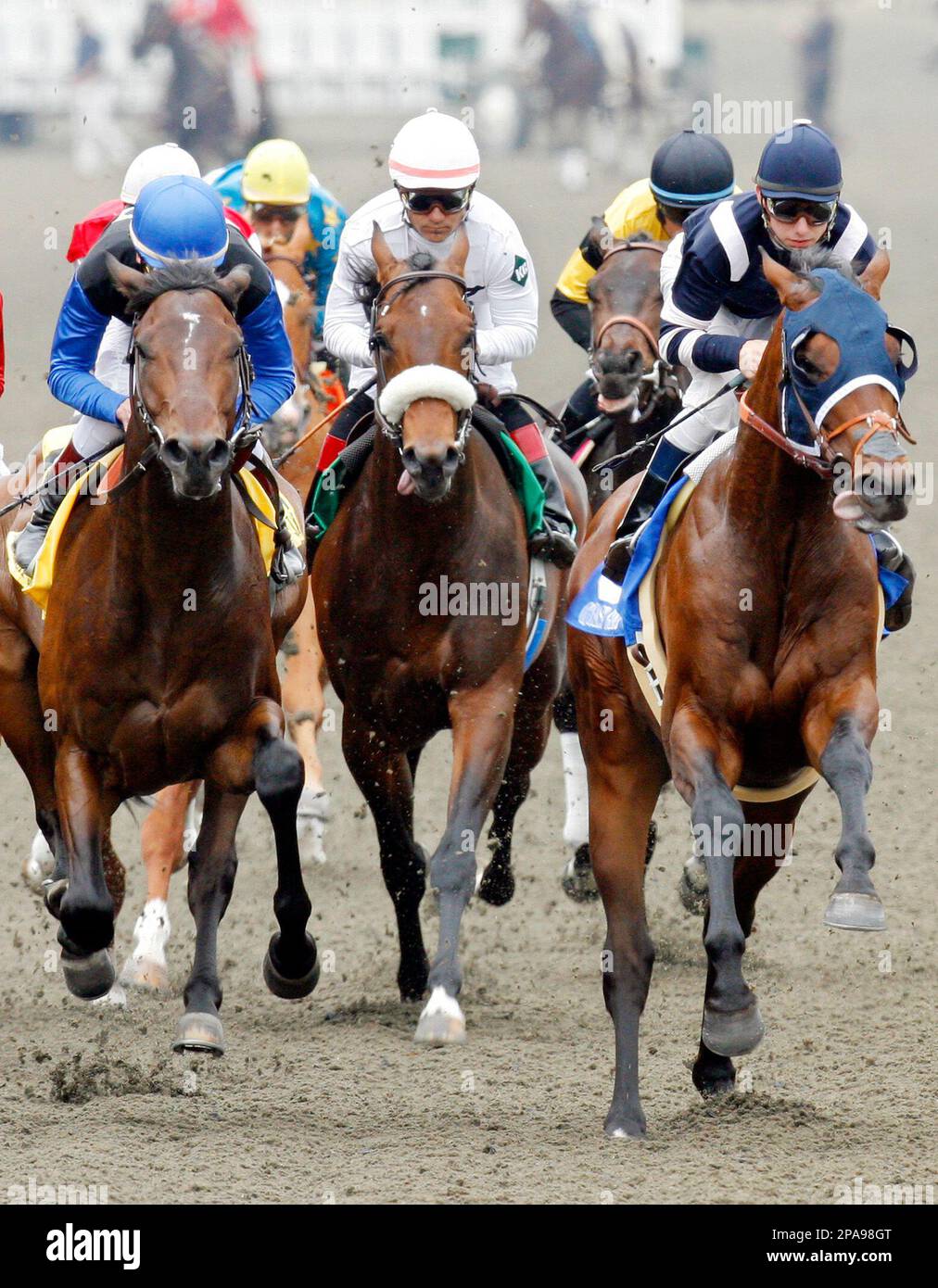 Jockey Corey Nakatani, center, atop Colonel John rides during alongside ...