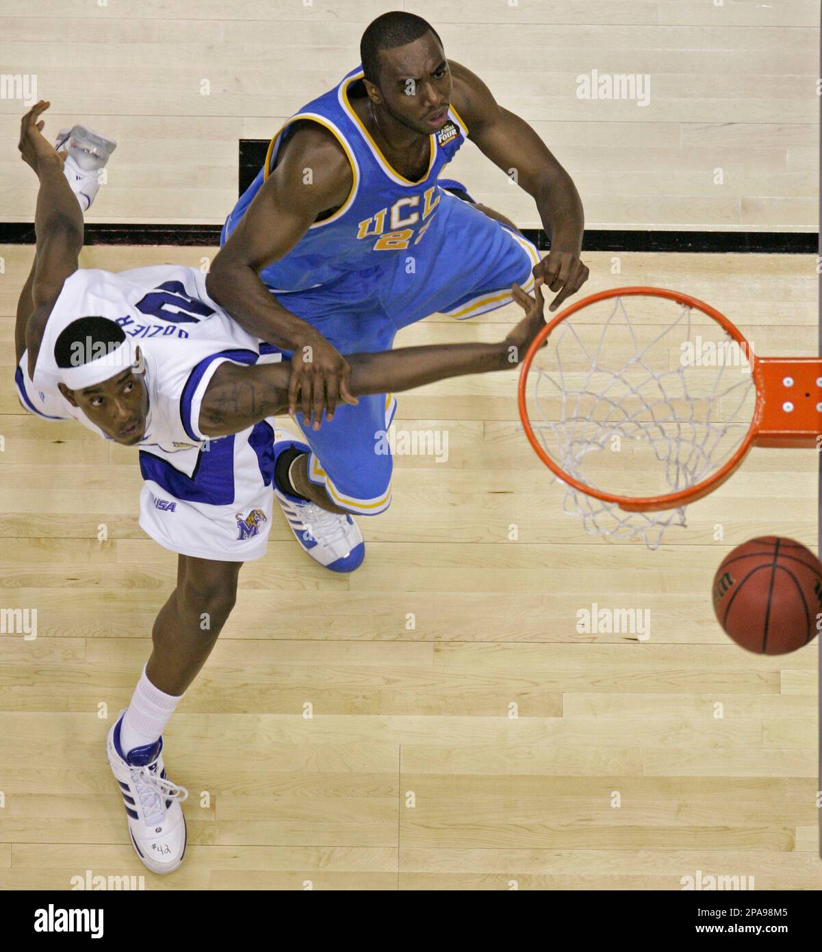 UCLA's Luc Richard Mbah a Moute, right, battles Memphis' Robert Dozier ...