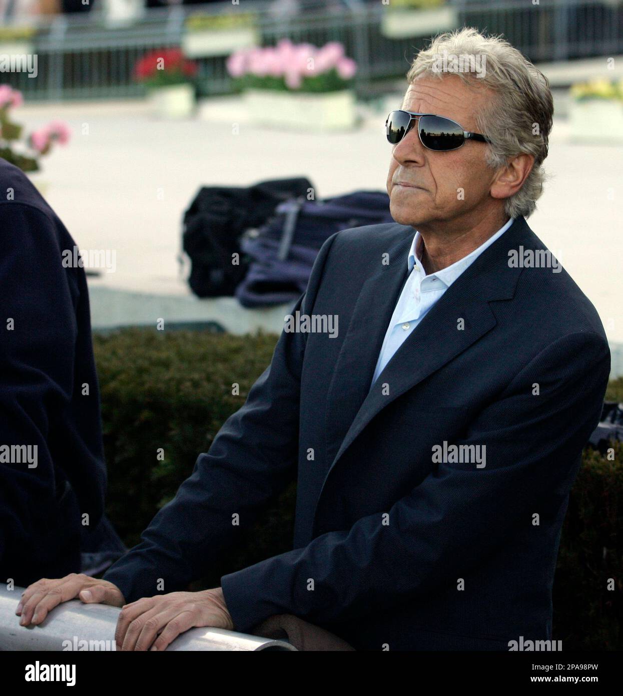Robert V. LaPenta, owner of race favorite War Pass, looks on after Tale ...
