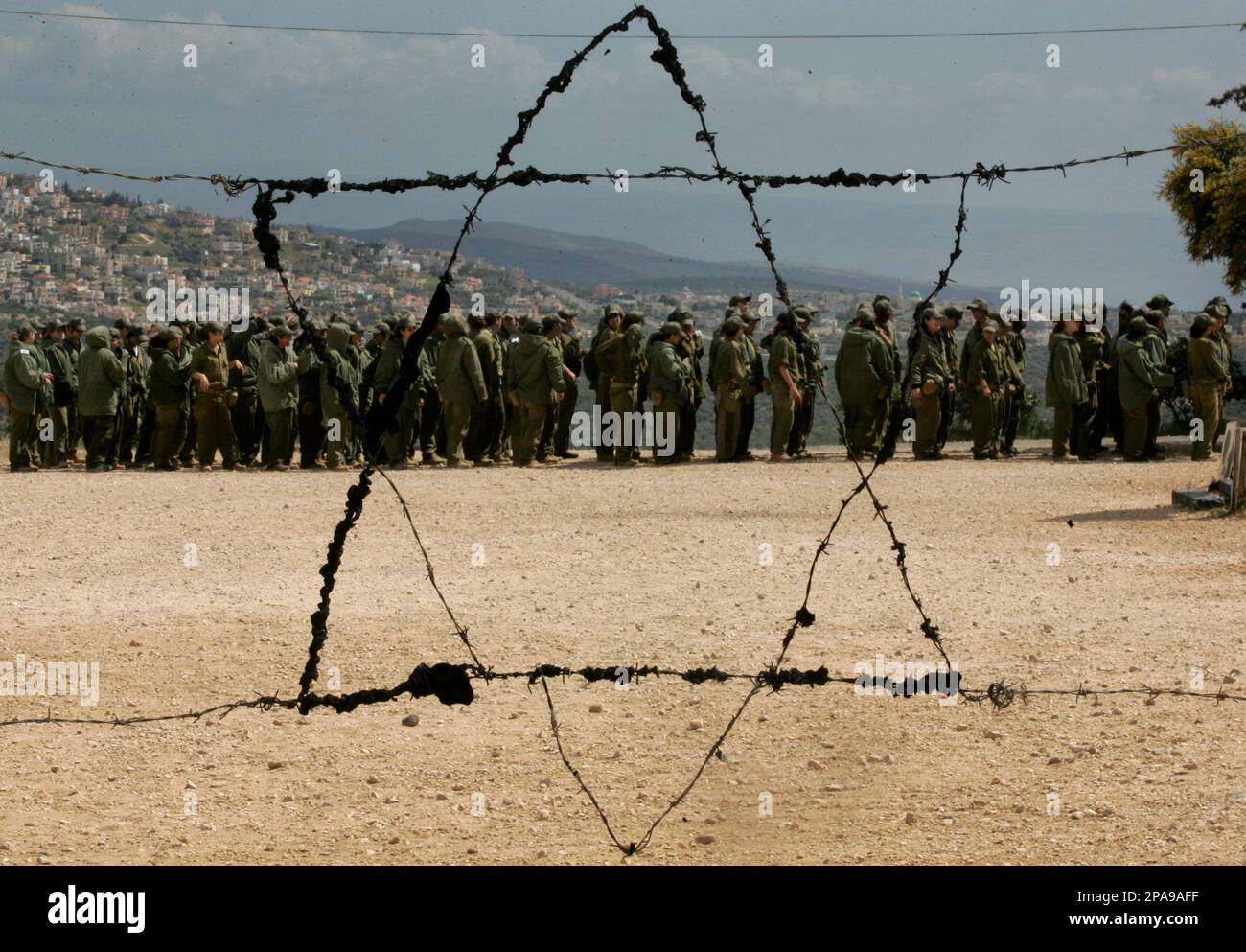Israeli youths dressed in army uniforms stand in formation during a one ...