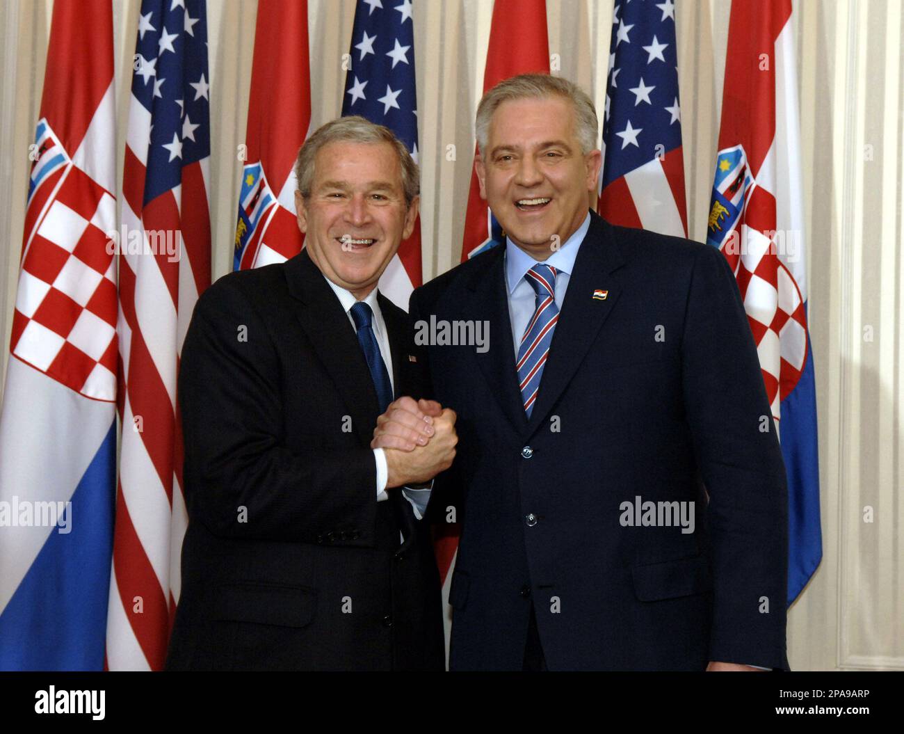 President George W. Bush gestures with Croatian Prime Minister Ivo ...
