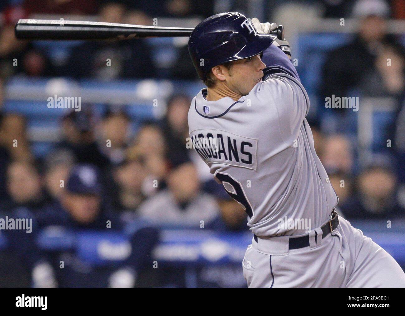 Tampa Bay Rays' Shawn Riggans follows through on a three-run double ...