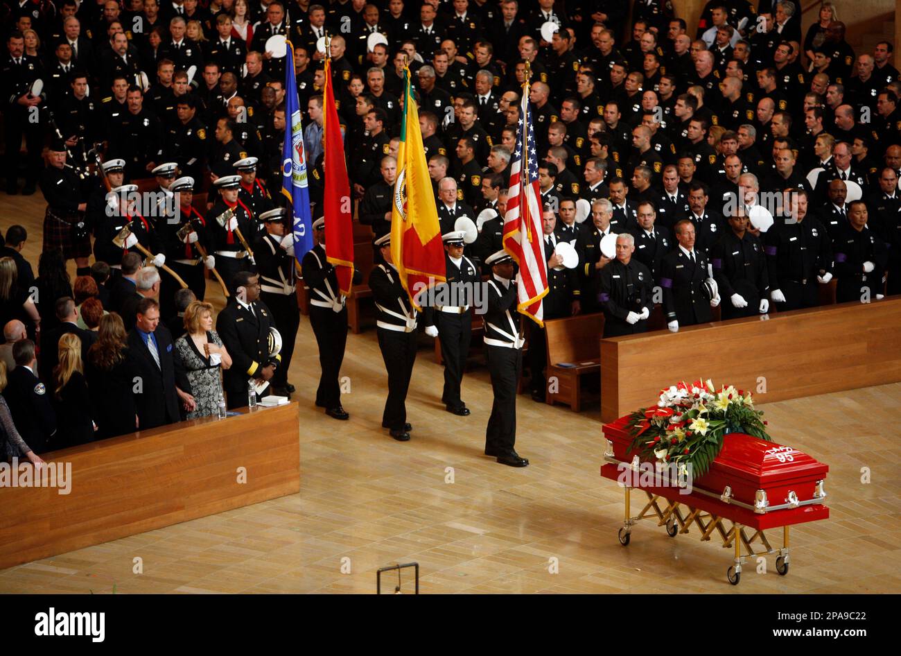 A firefighter color guard approaches the casket of Los Angeles ...