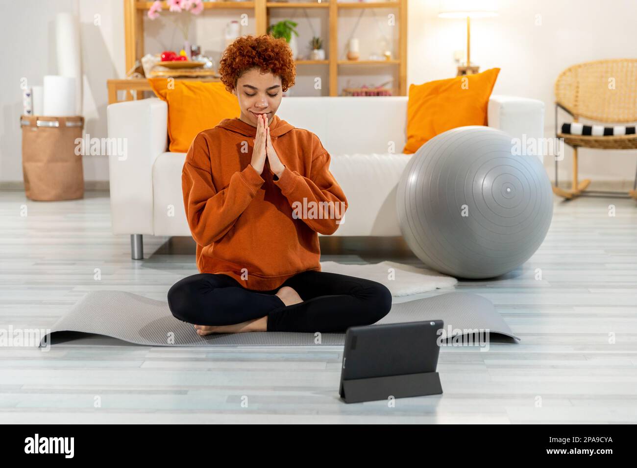 Yoga mindfulness meditation. Young healthy african girl practicing yoga ...