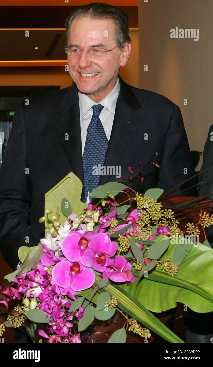 IOC President Jacques Rogge arrives at the VIP complex in Changi ...