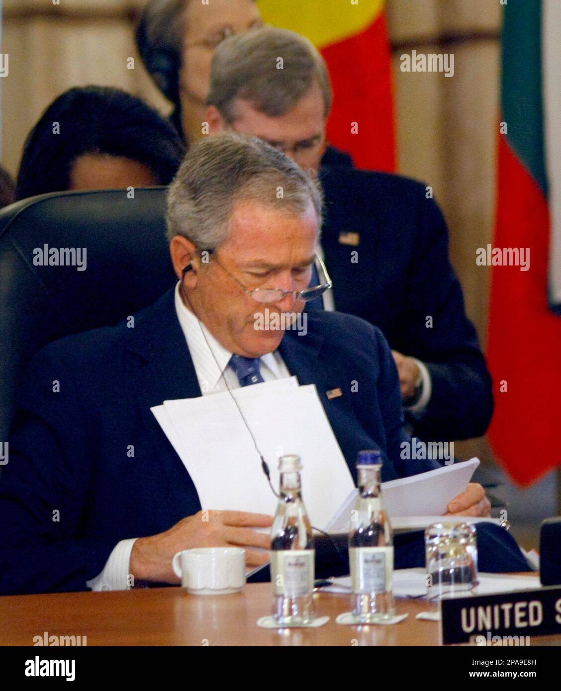 U.S. President George W. Bush looks through papers prior to the start ...