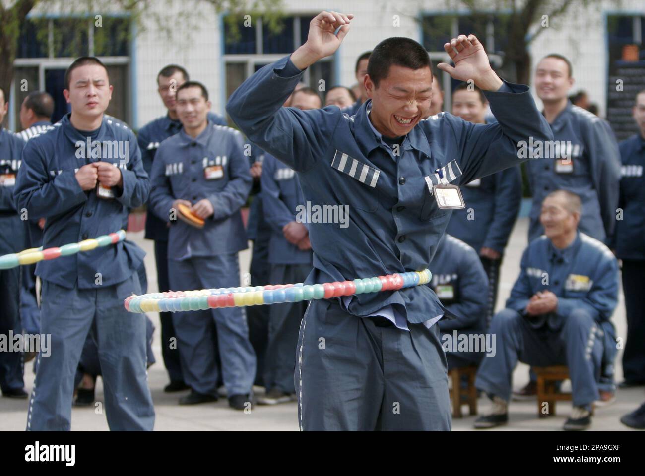 An inmate competes in a hula-hoop contest at Yuxi Prison in Luoyang, in ...