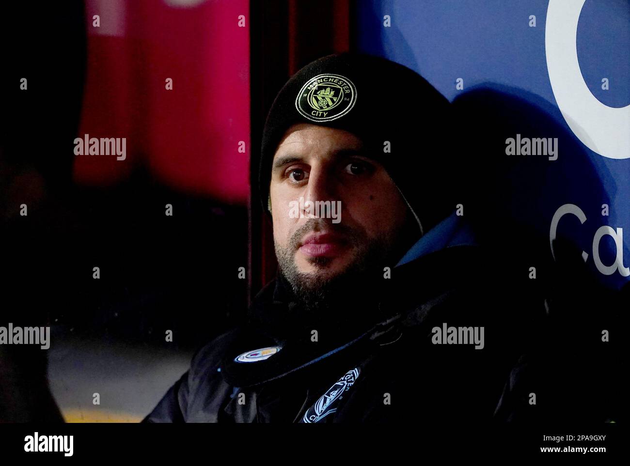Manchester City's Kyle Walker sits on the bench ahead of the Premier ...