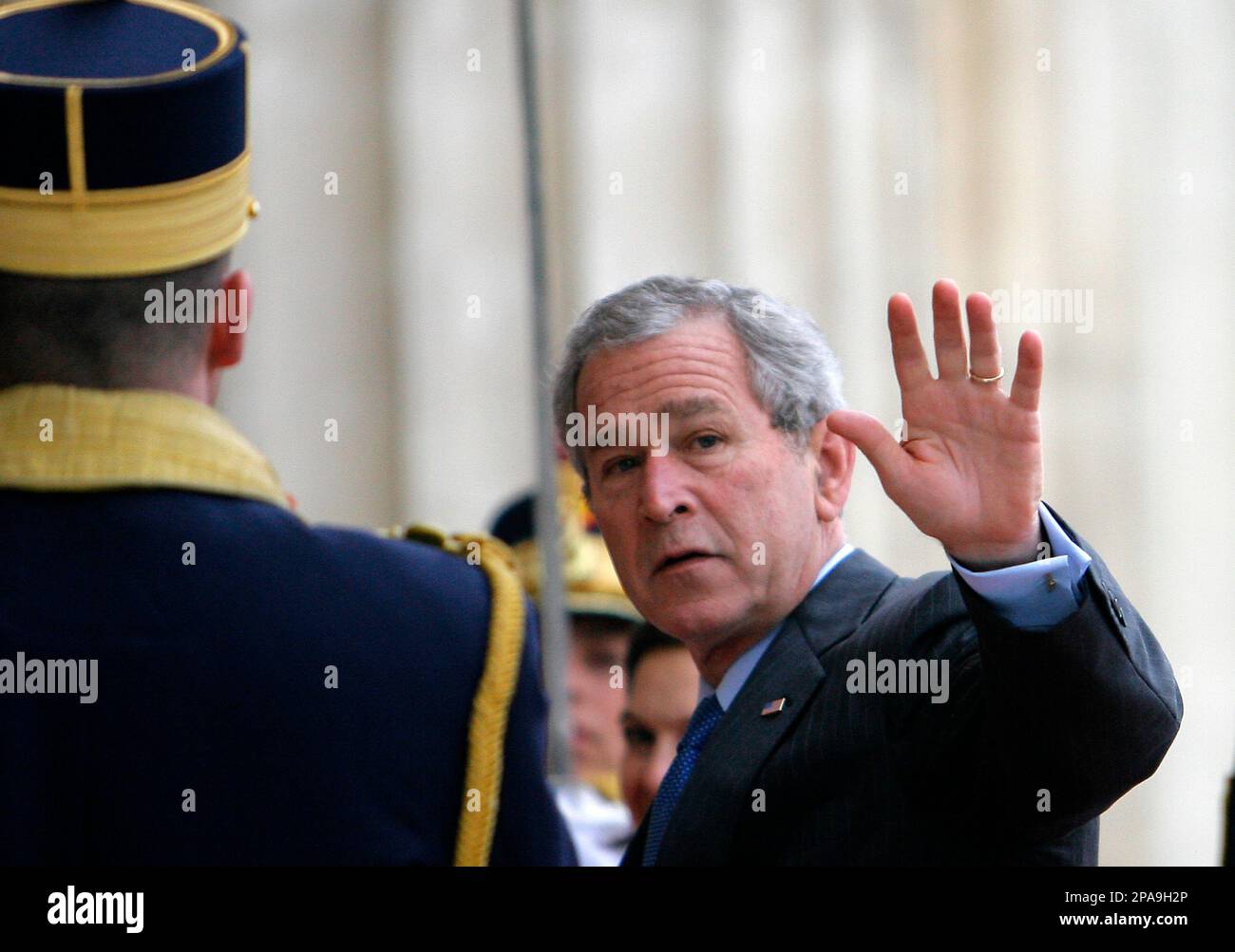 US President George W. Bush waves as he arrives at Romania's People's ...