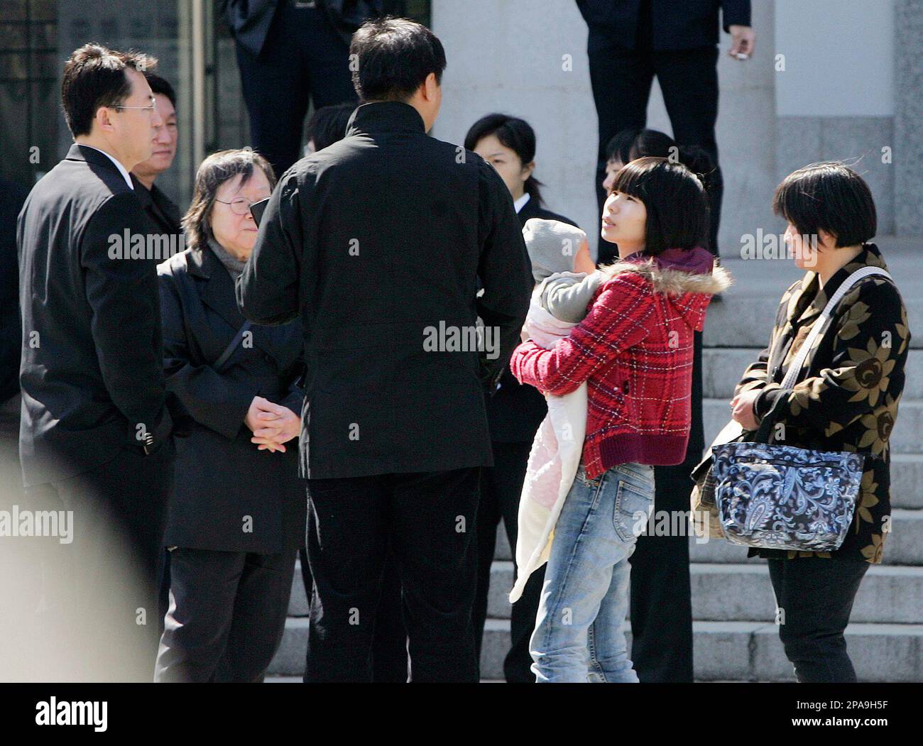 Zeng Jinyan, second right, the wife of civil rights activist Hu Jia ...