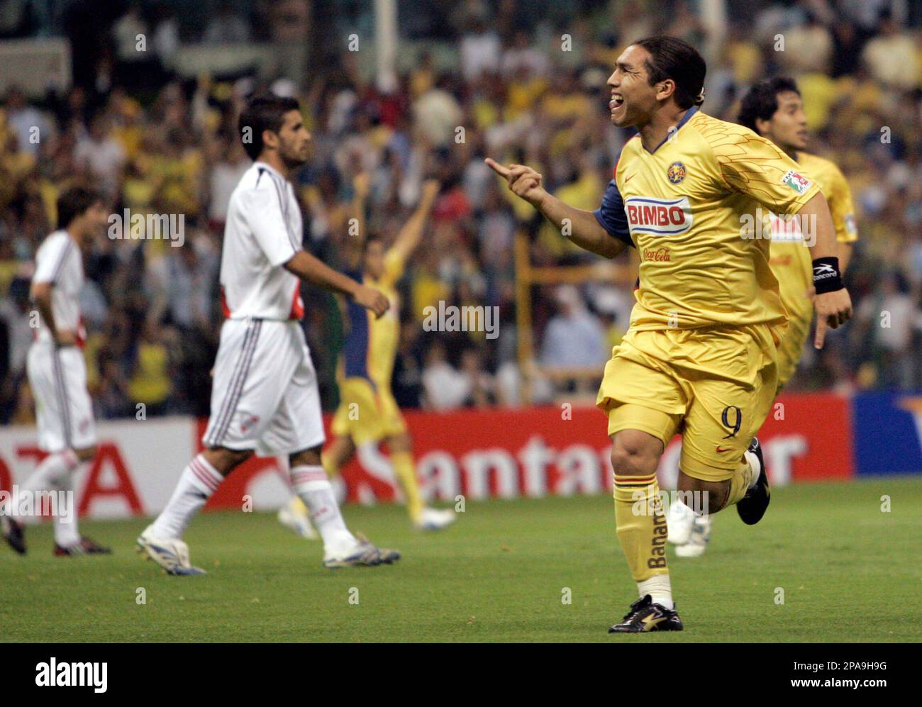 Mexico's America's Salvador Cabanas, right, from Paraguay, celebrates ...