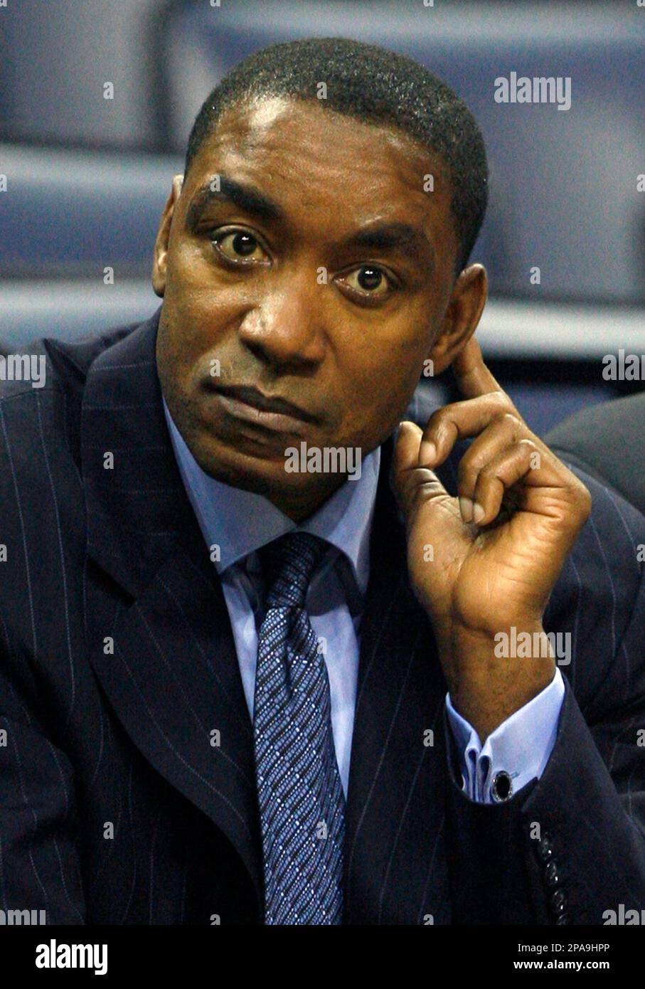 Knicks head coach Isiah Thomas stares into the crowd during an NBA ...