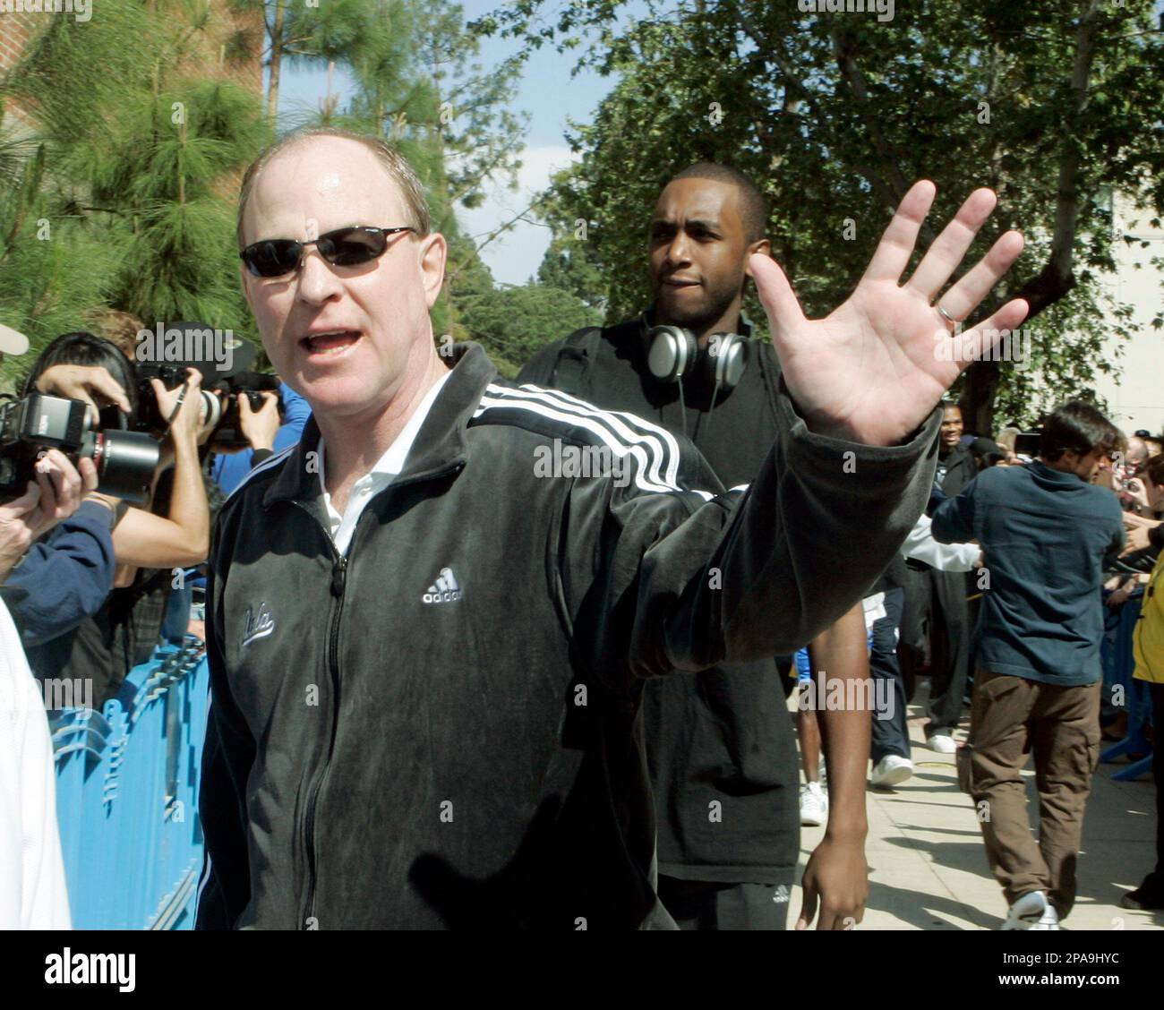 UCLA men's basketball coach Ben Howland waves as the Bruins team ...