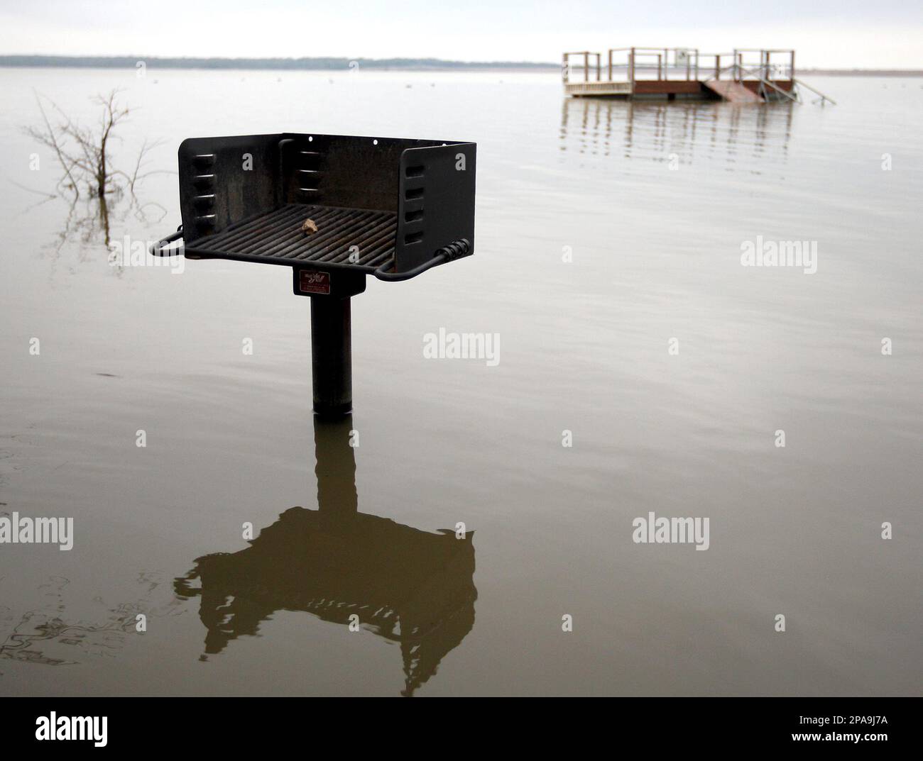 A barbecue pit sits under water at Pat Mayse Lake near Chicota, Texas ...