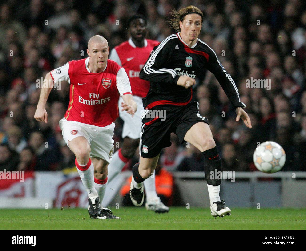 Arsenal's Philippe Senderos, left, and Liverpool's Fernando Torres ...