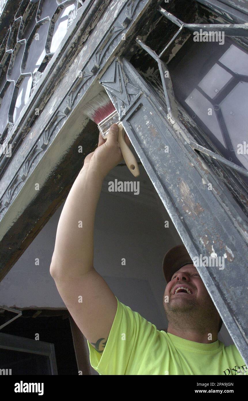 **ADVANCE FOR SUNDAY APRIL 6**Brian Burriss paints a door frame ...
