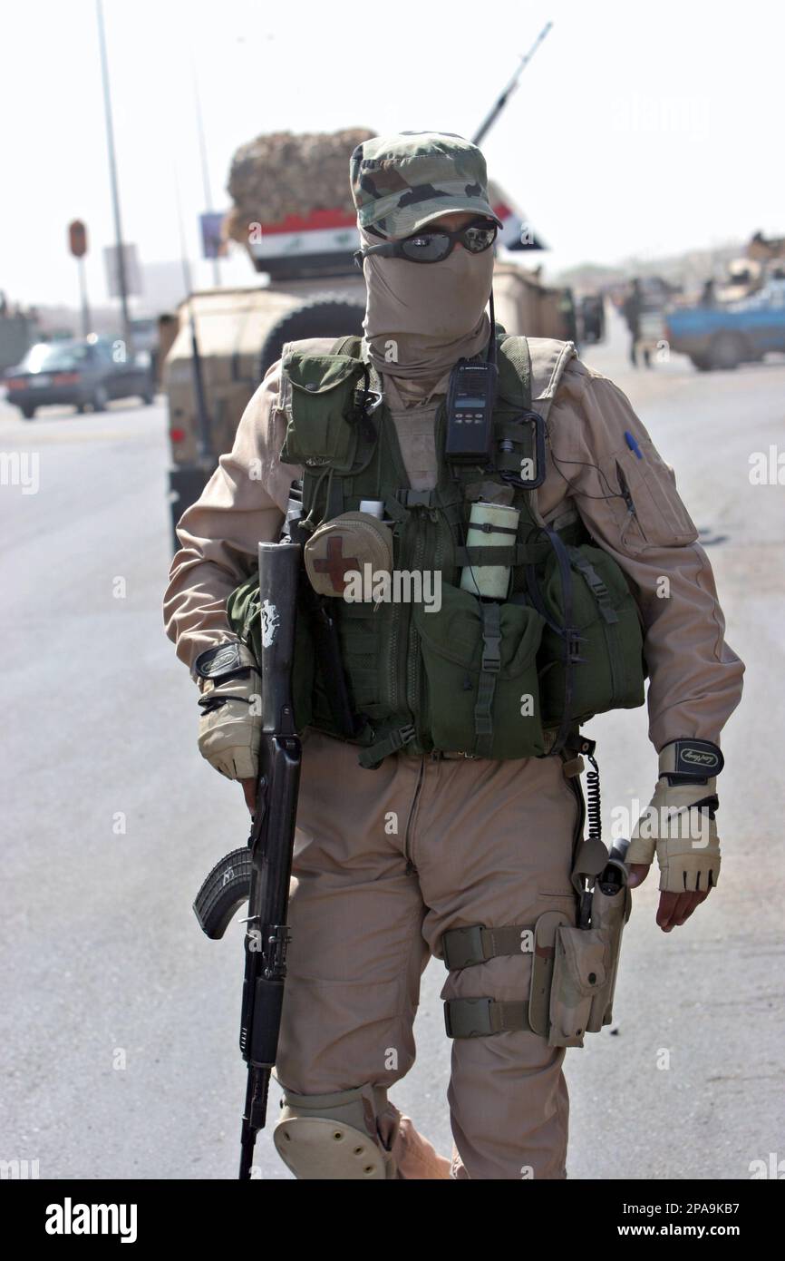 Iraqi soldier secures a street in a show of force in a militia ...