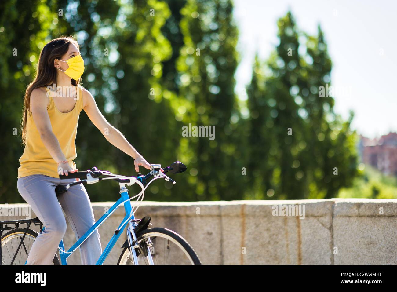 bicycle rider wearing a protection mask for pollution in the city ...
