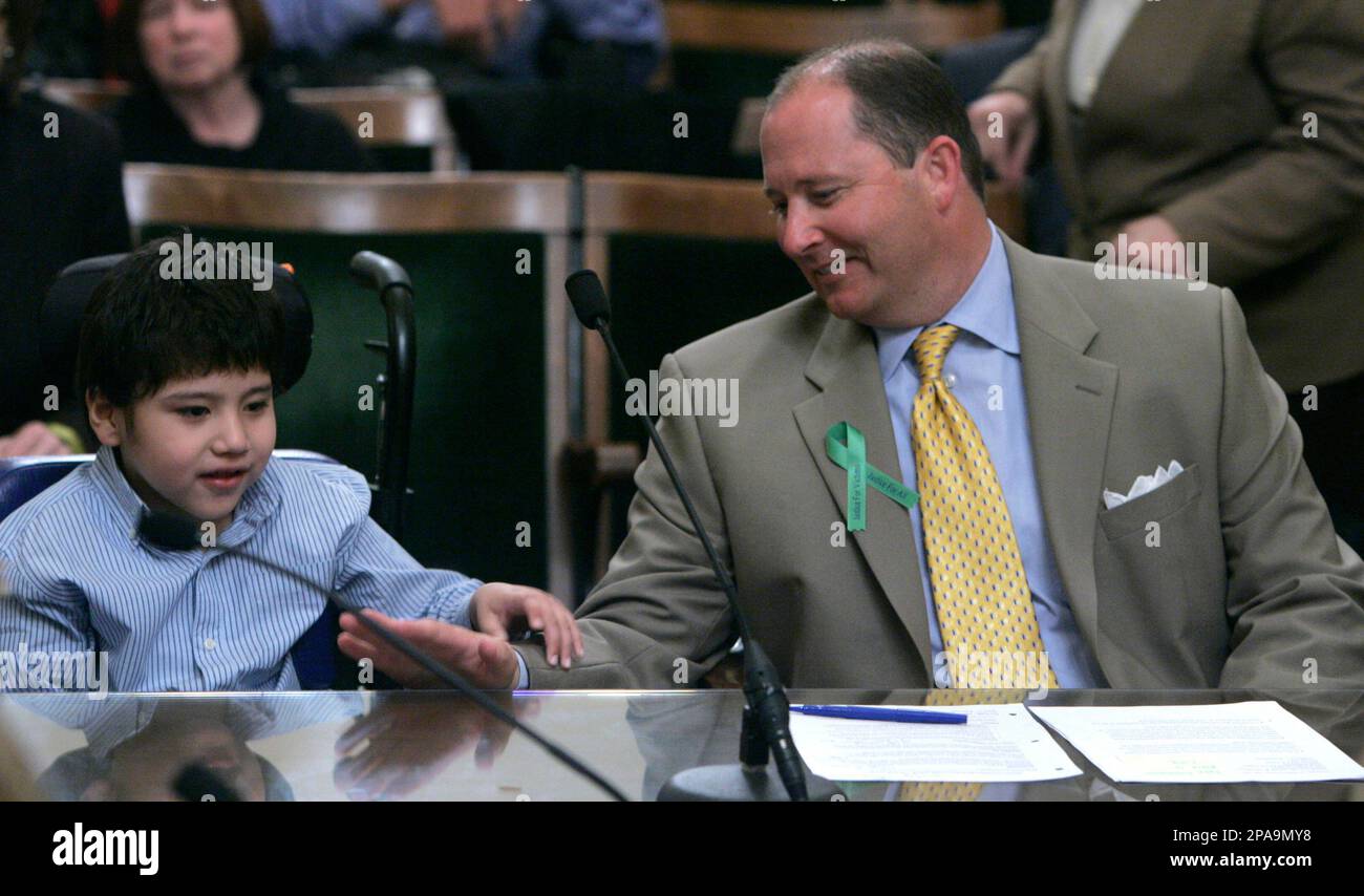 Adam Carbajal, 3, left, grabs the arm of Assembly Minority Leader Mike ...