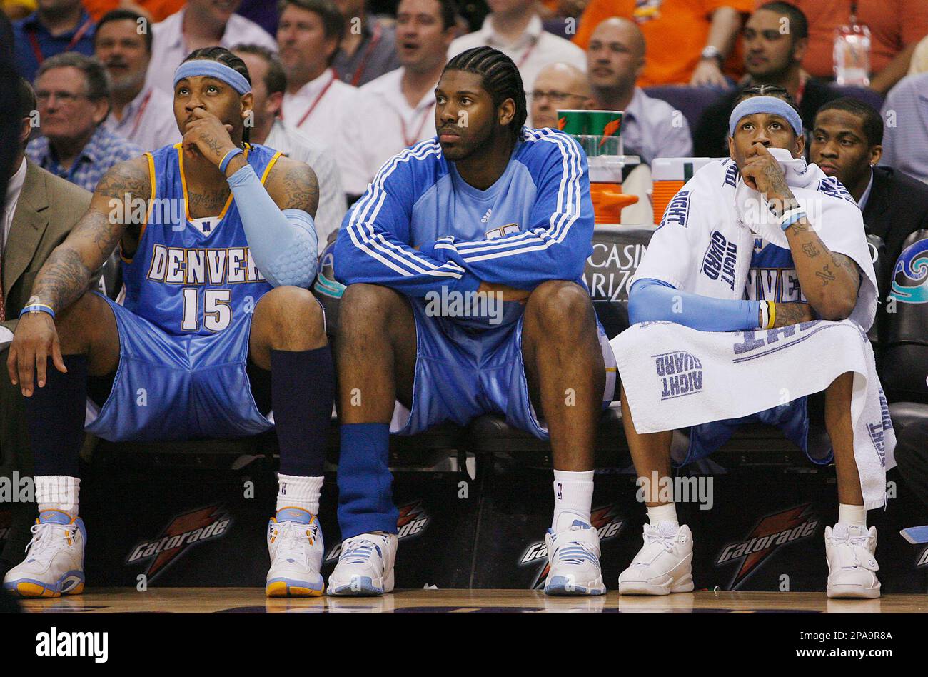 Denver Nuggets' Carmelo Anthony, left, and Allen Iverson, right, look ...