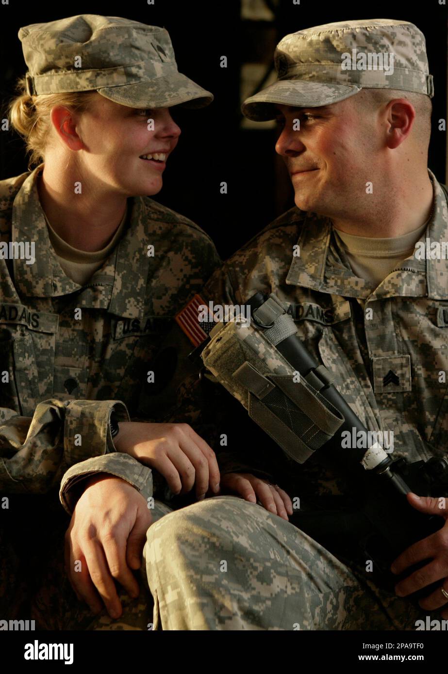 U.S. Army Spc. Chelsea Adams, 26, left, her husband, Sgt. Cameron Adams ...