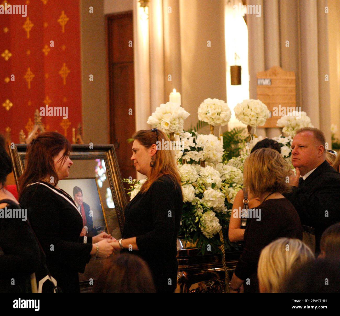 Members of Al Copeland's family greet guests paying their respects in ...