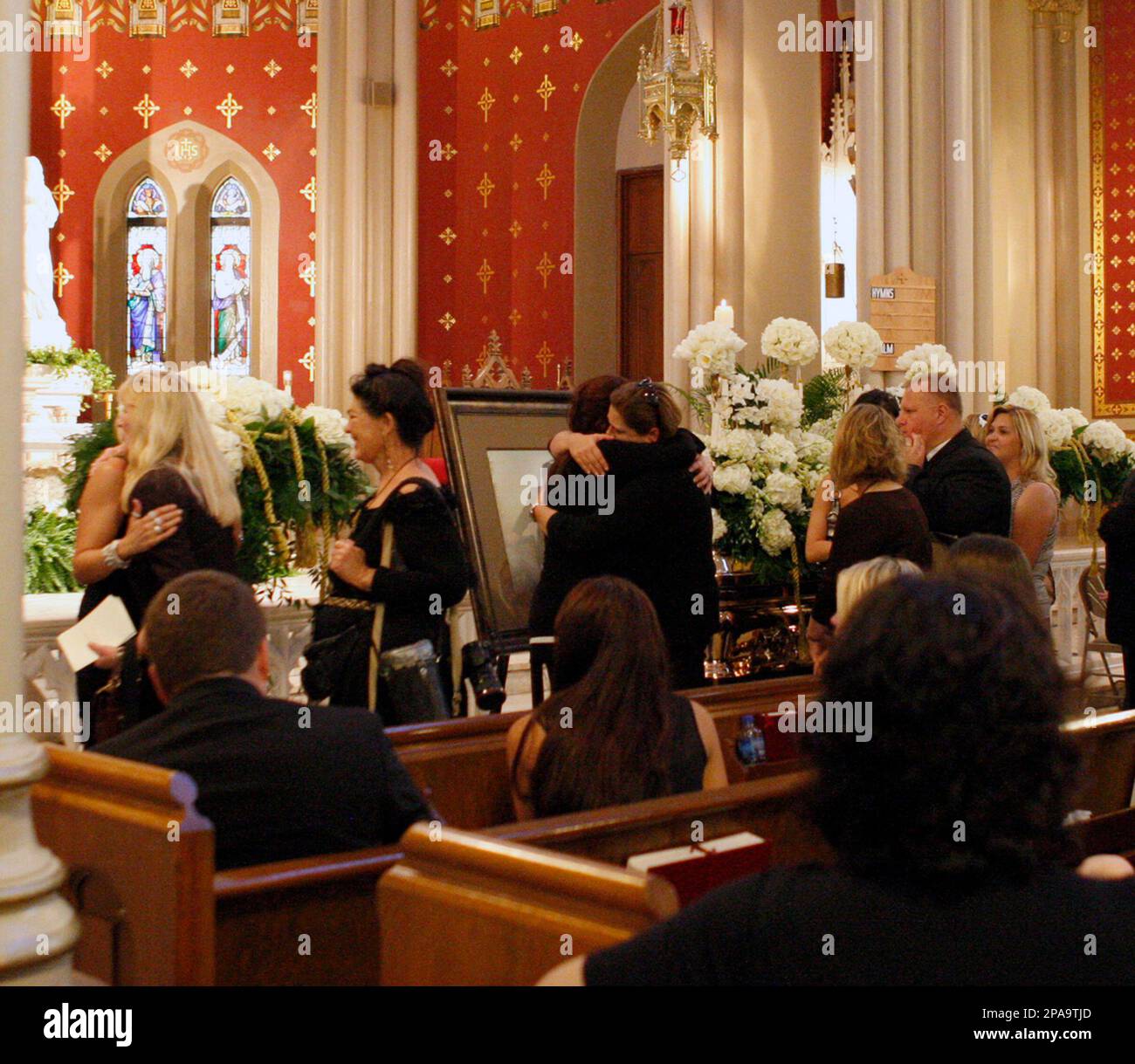Members of Al Copeland's family greet guests paying their respects in ...