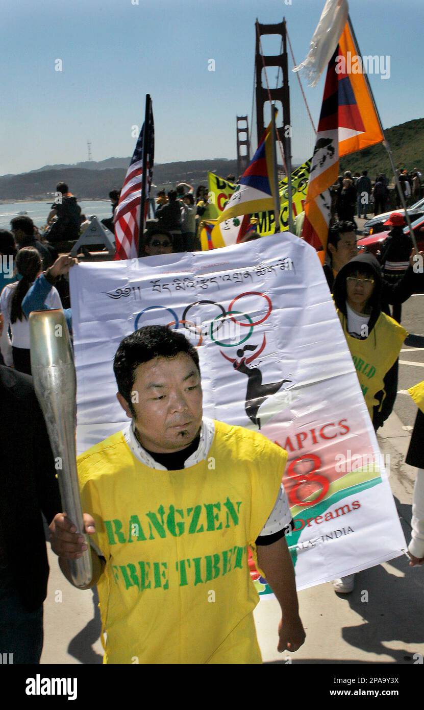 Tsetan Dorjee of Albany, Calif., walks through the parking of the ...